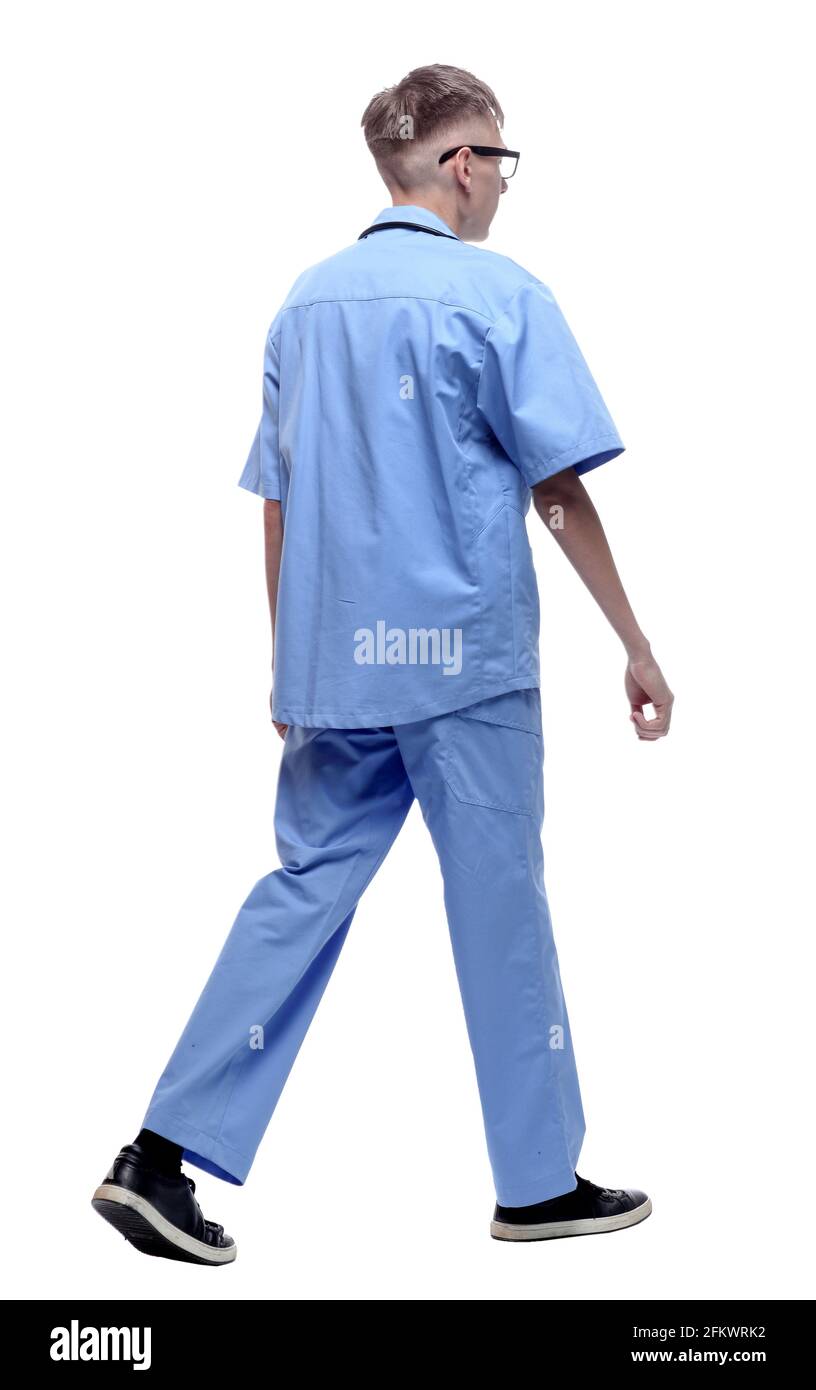 side view. serious young doctor striding forward Stock Photo - Alamy