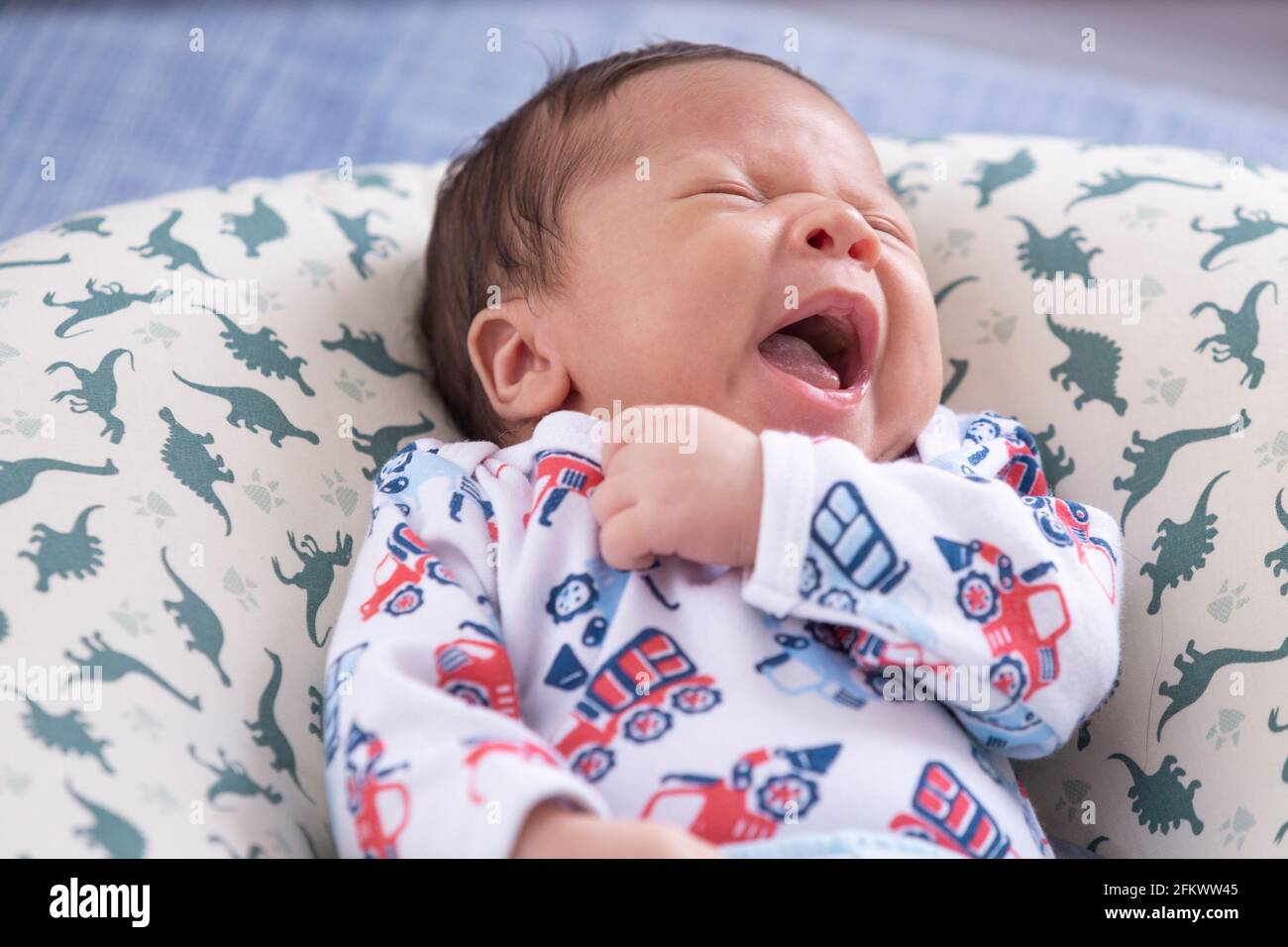 Hungry crying baby in bed, top view Stock Photo - Alamy