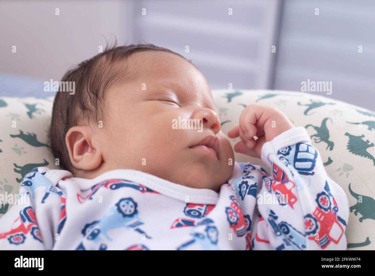 Close on baby sunday on pillow and with light on his face Stock Photo ...