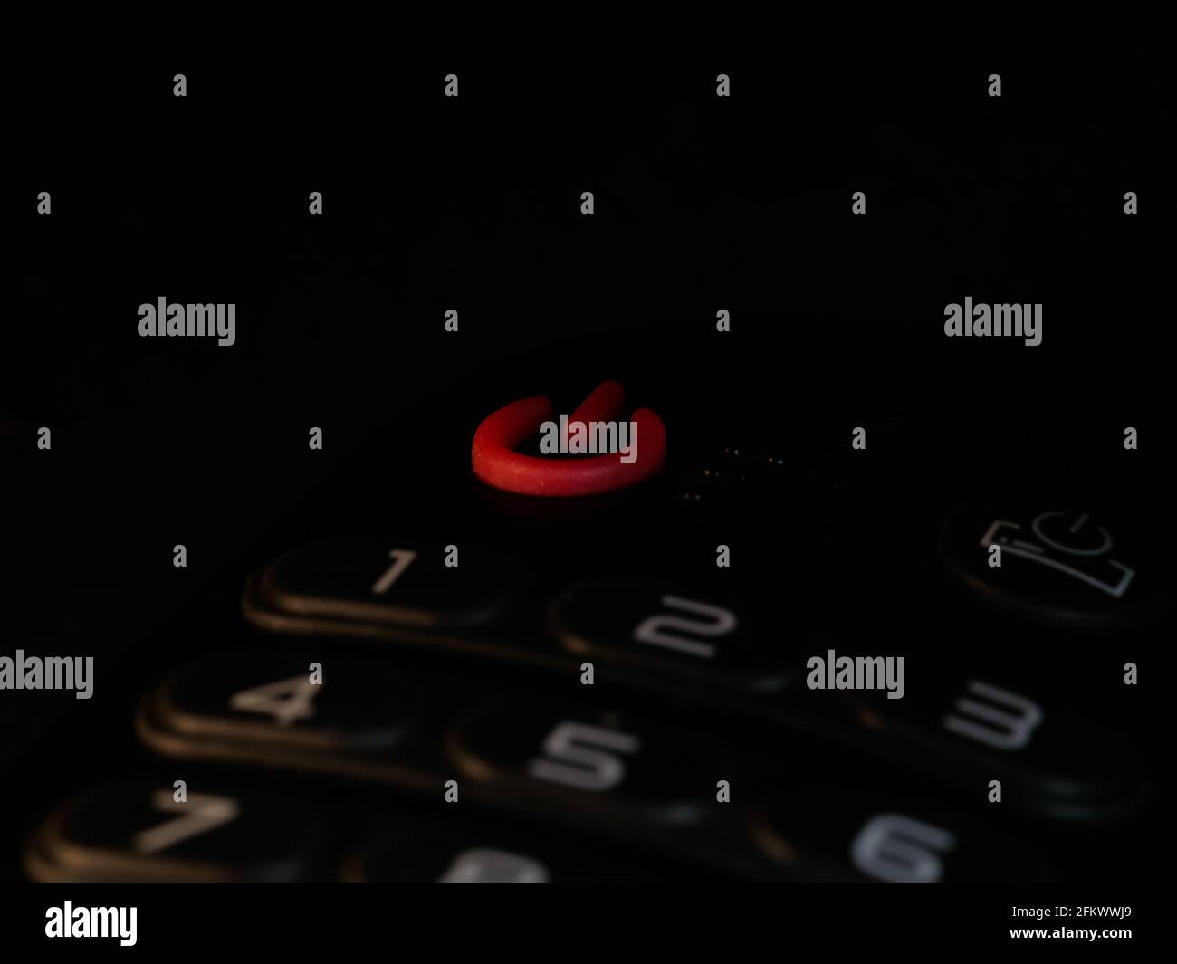 Selective focus shot of remote control with a red turn off button in ...