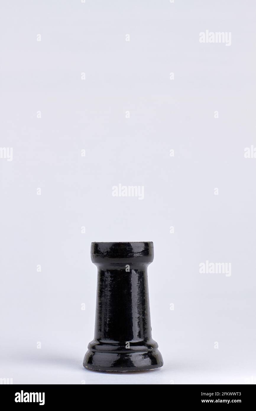 Black wooden rook chess piece. Isolated on white background Stock Photo ...