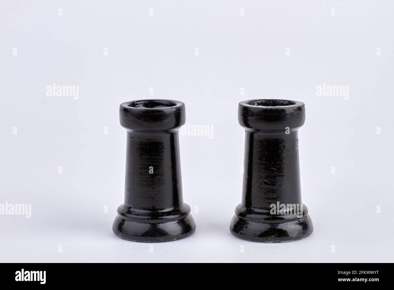 Two rook chess pieces against white background Stock Photo - Alamy