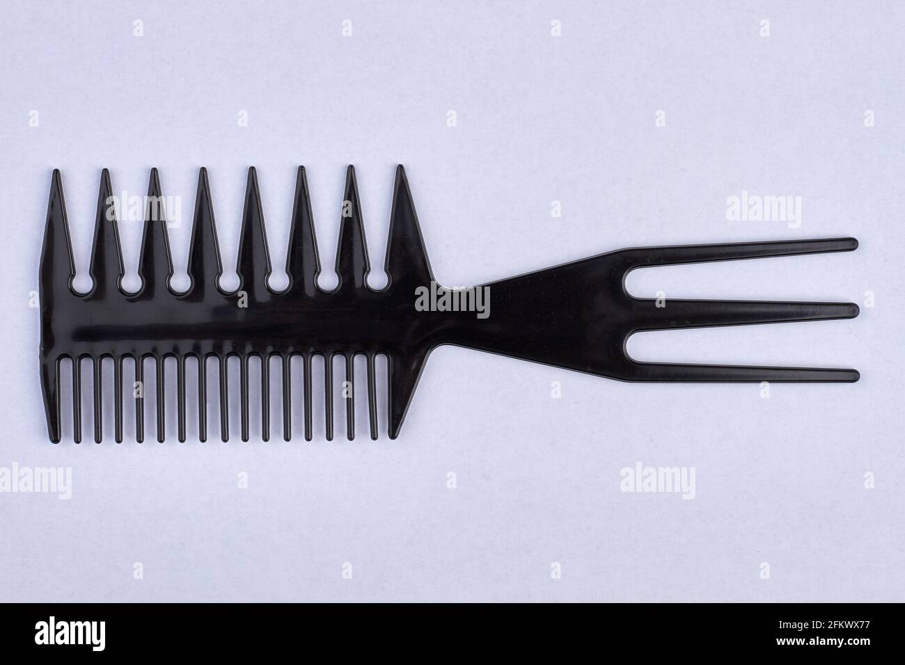 Black barber comb isolated on white background Stock Photo - Alamy