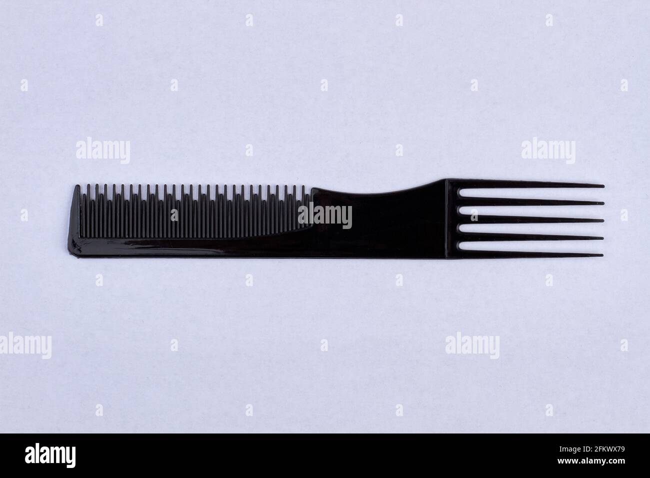 Barber plastic comb isolated on white background Stock Photo - Alamy