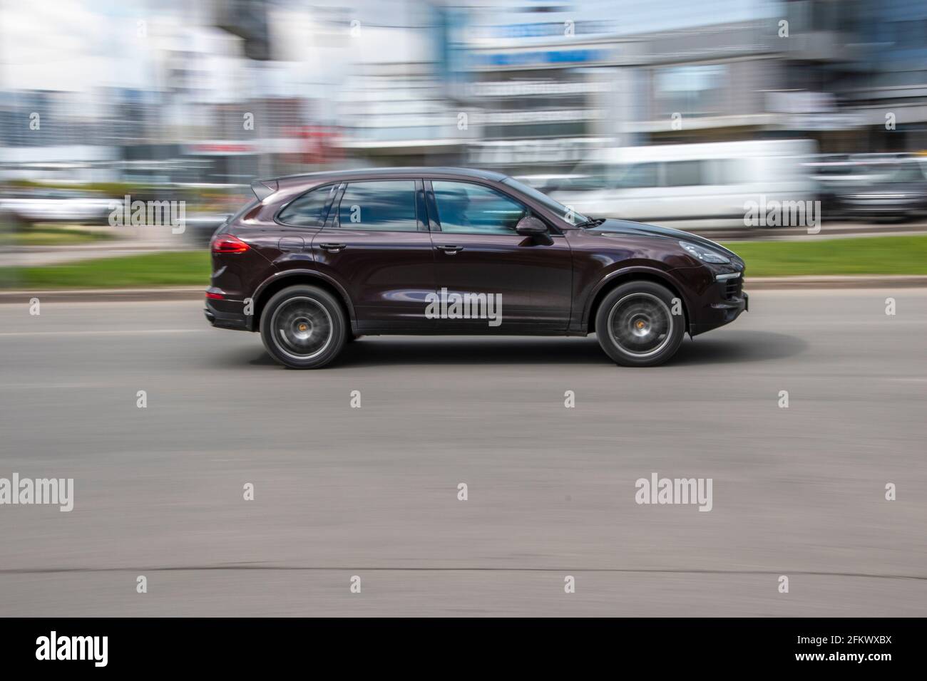 Ukraine, Kyiv - 26 April 2021: Brown Porsche Cayenne car moving on the ...