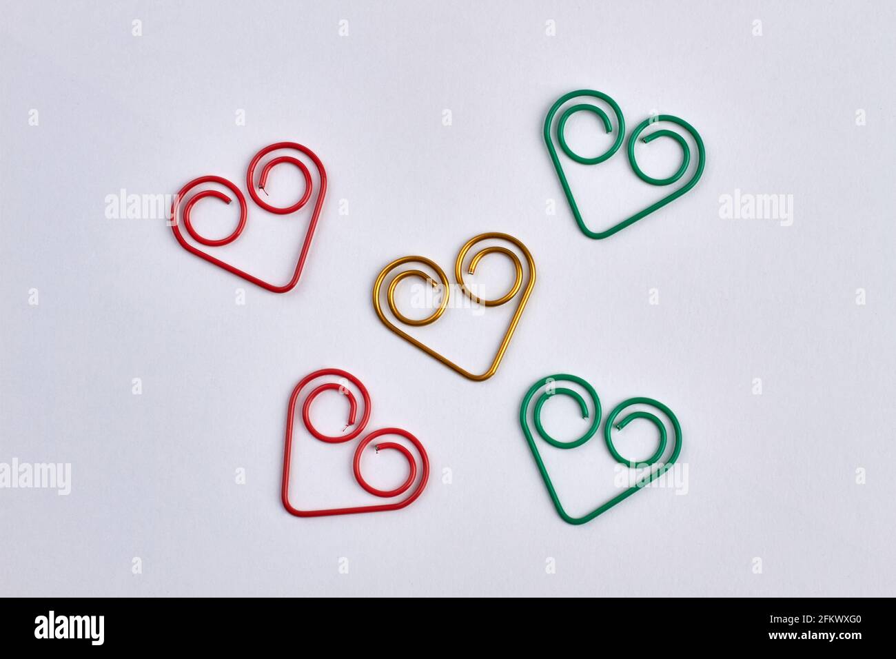 Colorful heart-shaped paper clips isolated on white background Stock ...