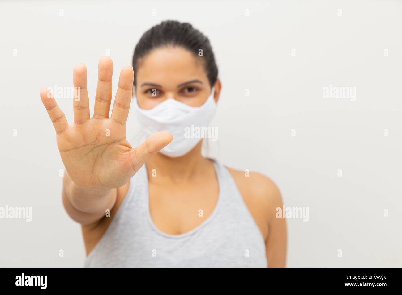 40 year old woman with mark and hand extended forward.Photo in hand ...