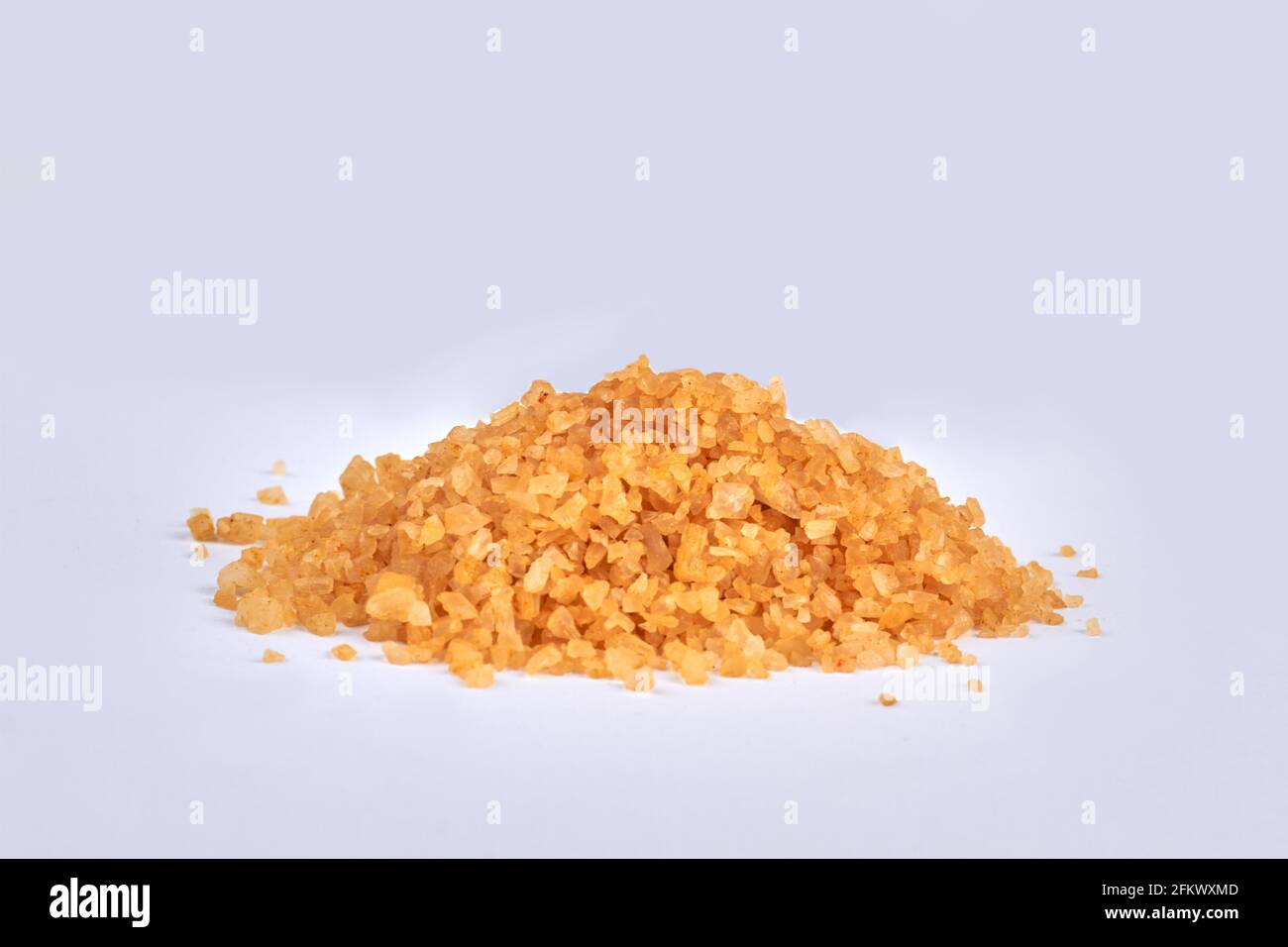 Pile of yellow bath salt isolated on white background Stock Photo - Alamy