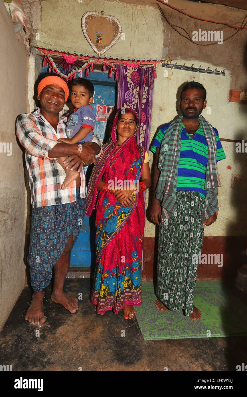 Tribal family photograph outside house. KOLI TRIBE. Odasinga Jodum of Cuttack, Odisha, India ...