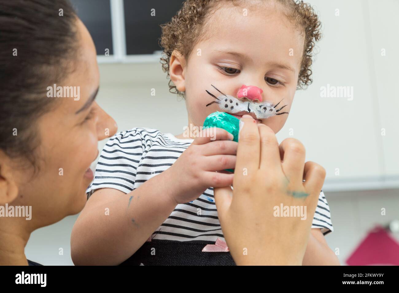 Child having fun with easter eggs Stock Photo - Alamy