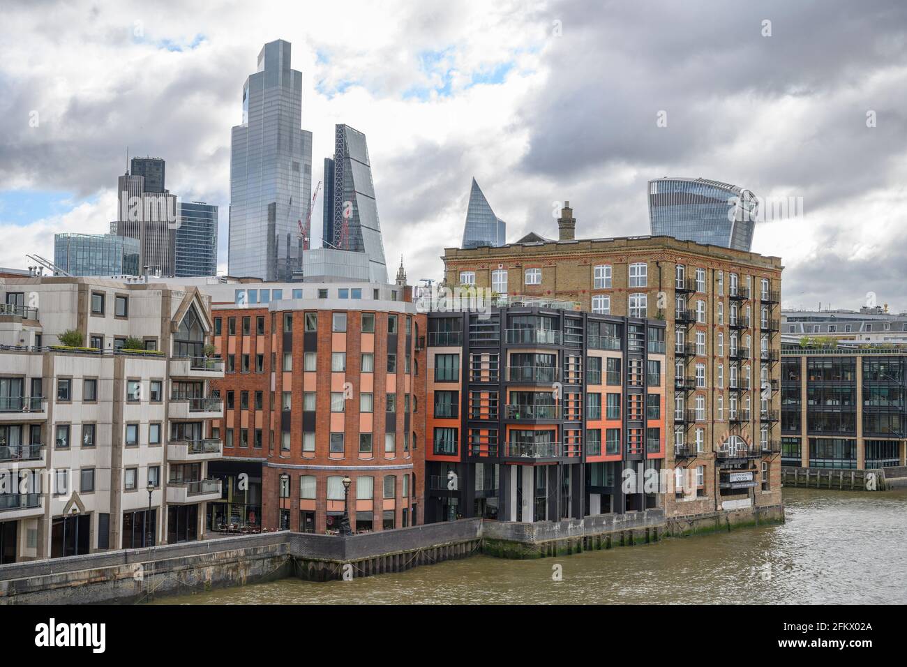 City of London skyscrapers above waterfront low-rise buildings on the ...