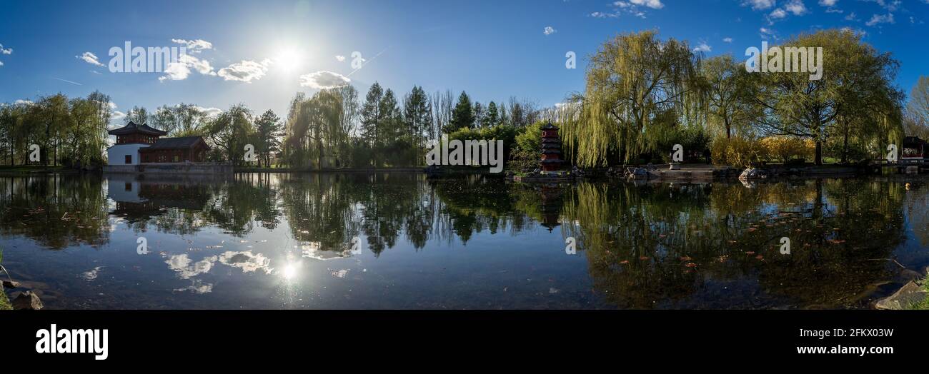 Chinese pagoda near the lake. Spring landscape. Panoramic view Stock ...