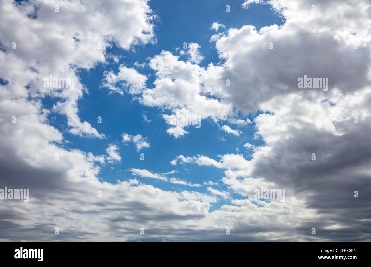 Fluffy cumulus clouds white and grey color, Cloudscape on blue sky ...