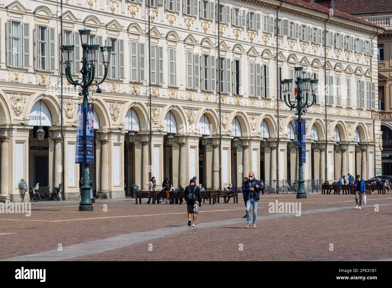 Woman walking street of facades hi-res stock photography and images - Alamy