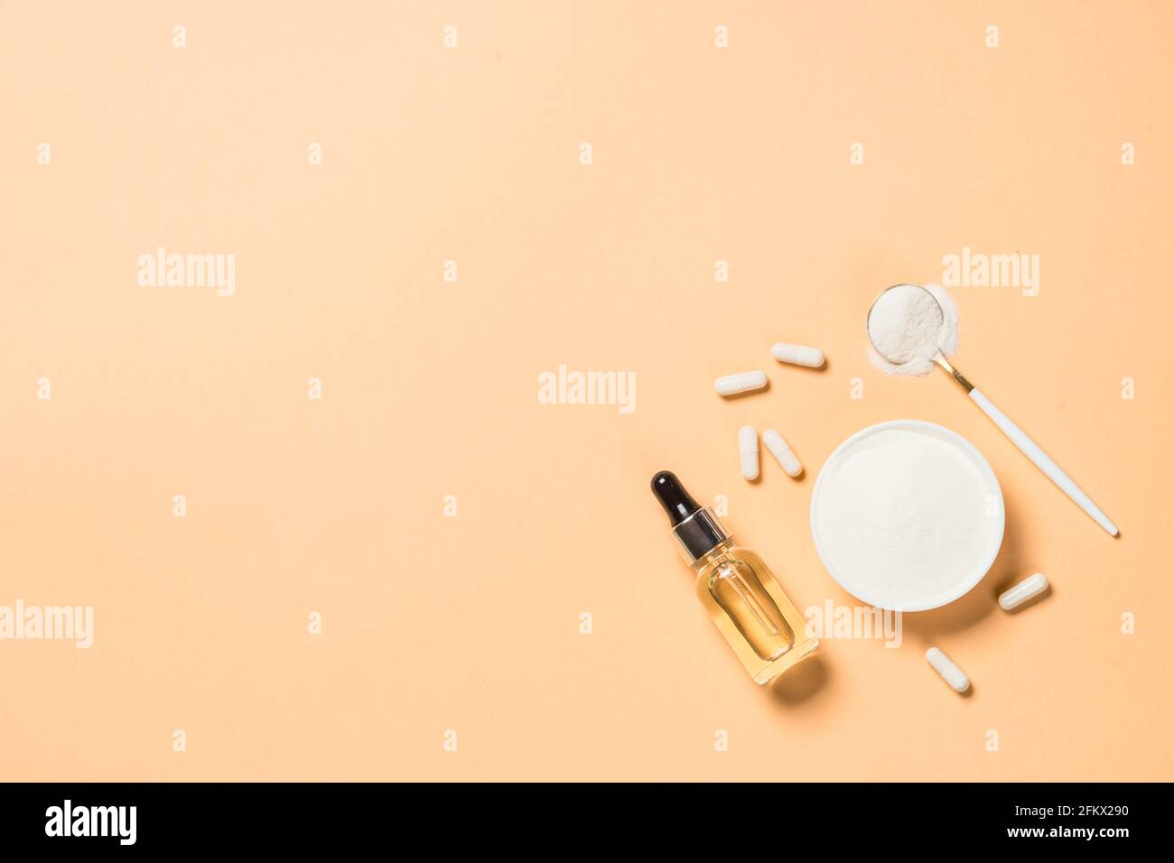 Collagen powder dietary supplement at pastel background Stock Photo - Alamy