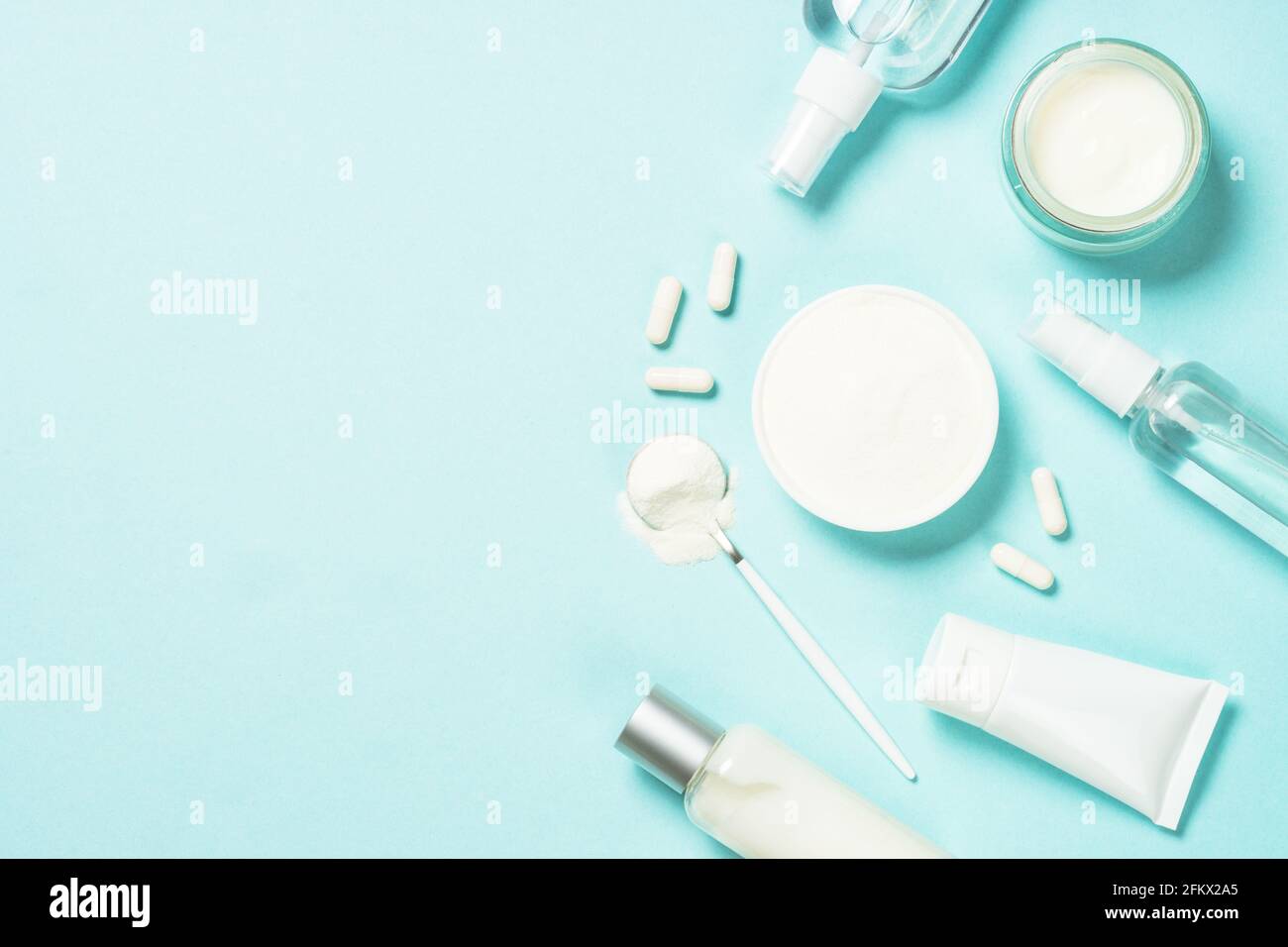 Collagen powder dietary supplement at blue background Stock Photo - Alamy