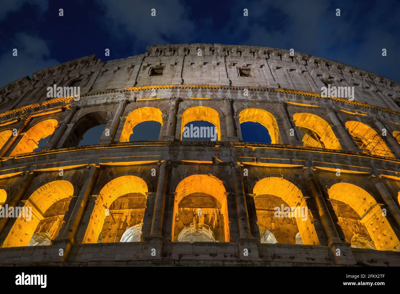 Arches of the Colosseum amphitheatre at night in Rome, Italy Stock ...