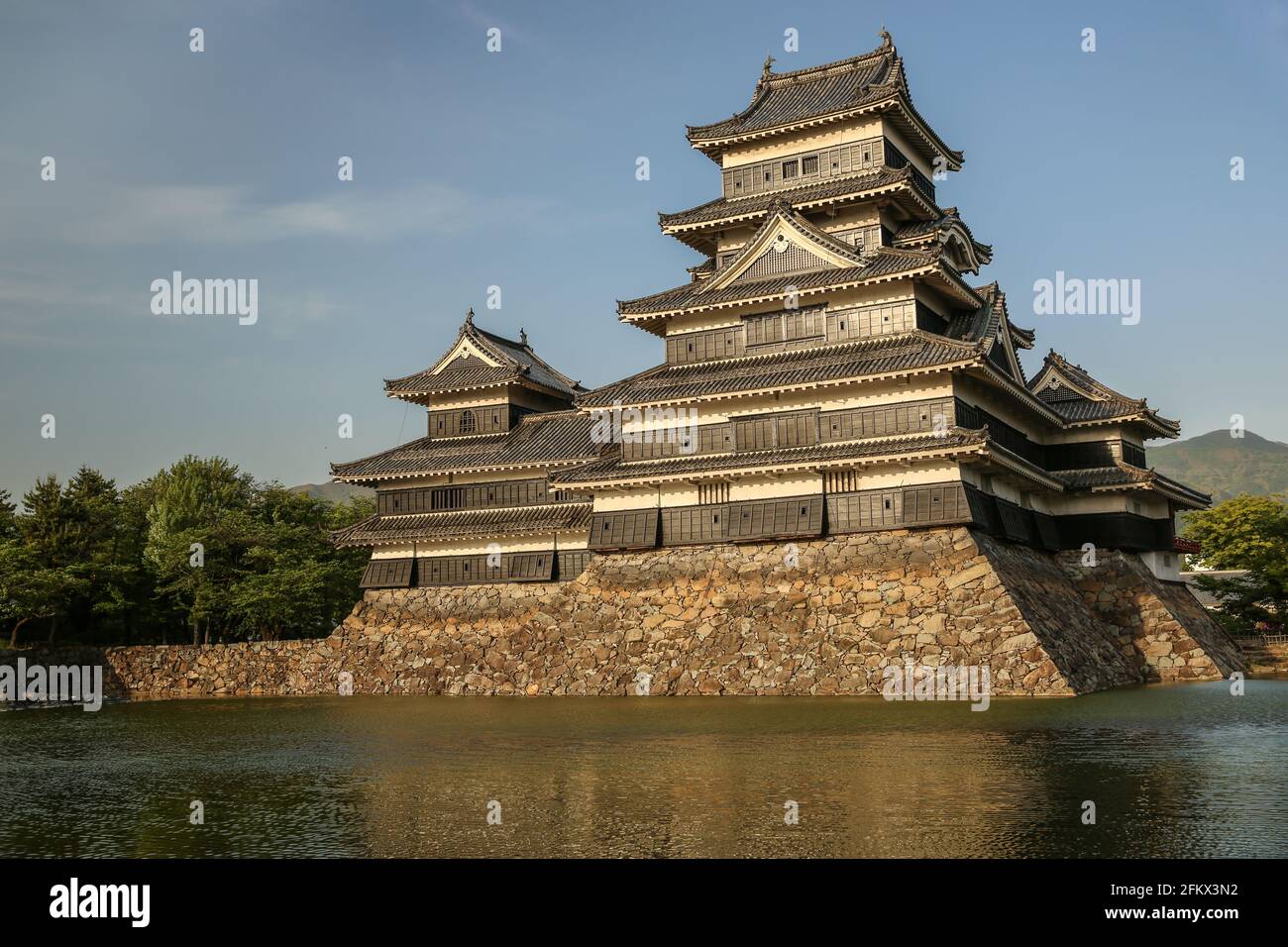 Japanese castle matsumoto with reflection in the moat hi-res stock ...