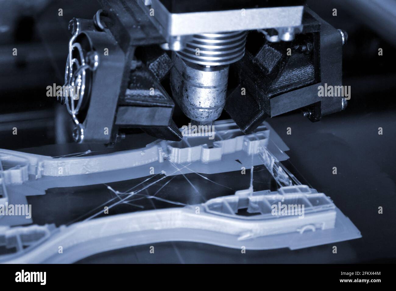 Printer printing gray objects on mirror reflective surface close-up top ...