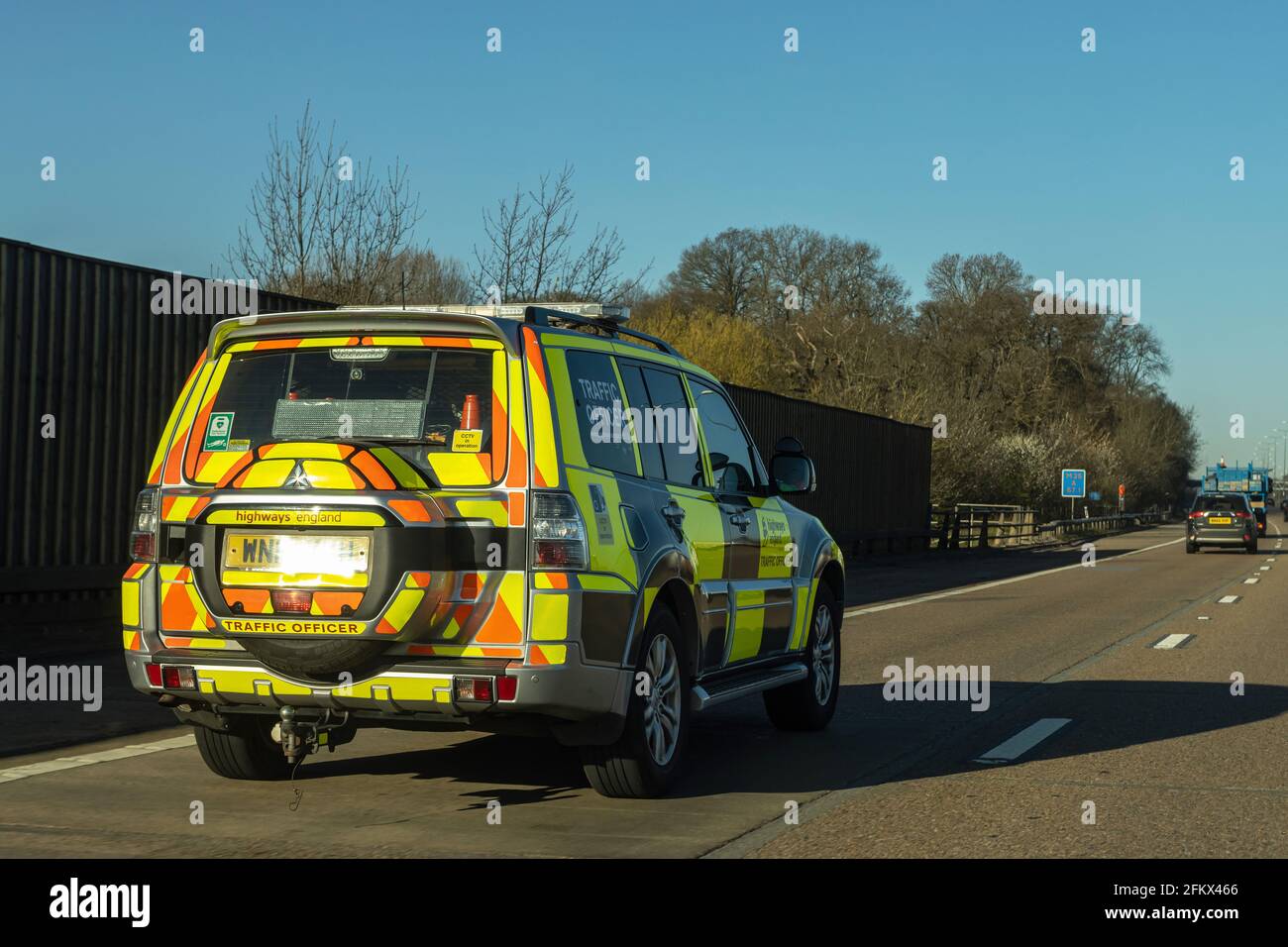 Highway maintenance vehicle on a motorway (back view Stock Photo - Alamy