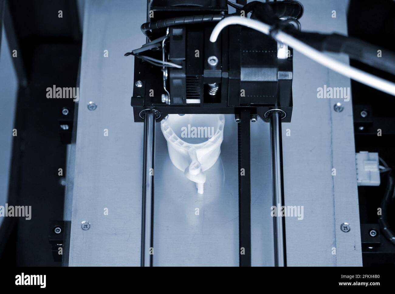 Objects printed by 3d printer. Automatic three dimensional 3d printer ...