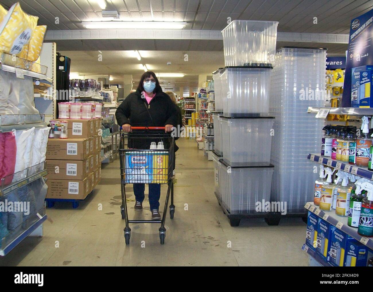 Person inside shopping trolley hi-res stock photography and images - Alamy
