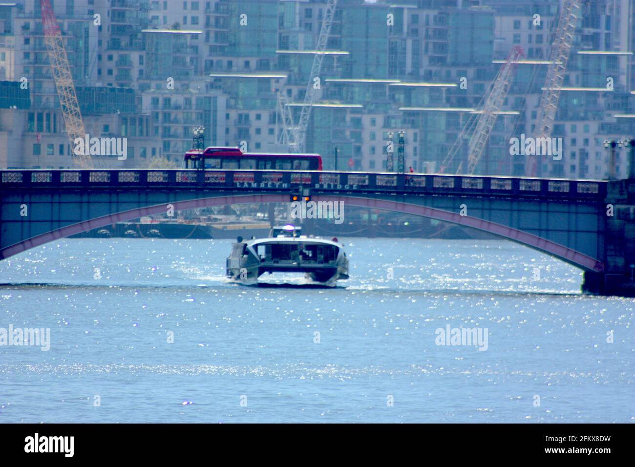Thames Clipper, London bus and the River Thames Stock Photo - Alamy
