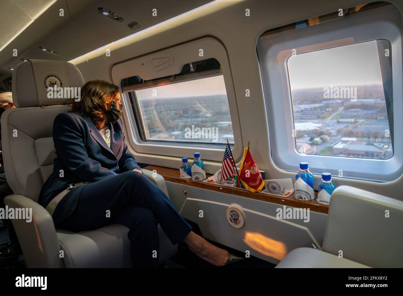 Vice President Kamala Harris looks out the windows of Marine Two as she ...