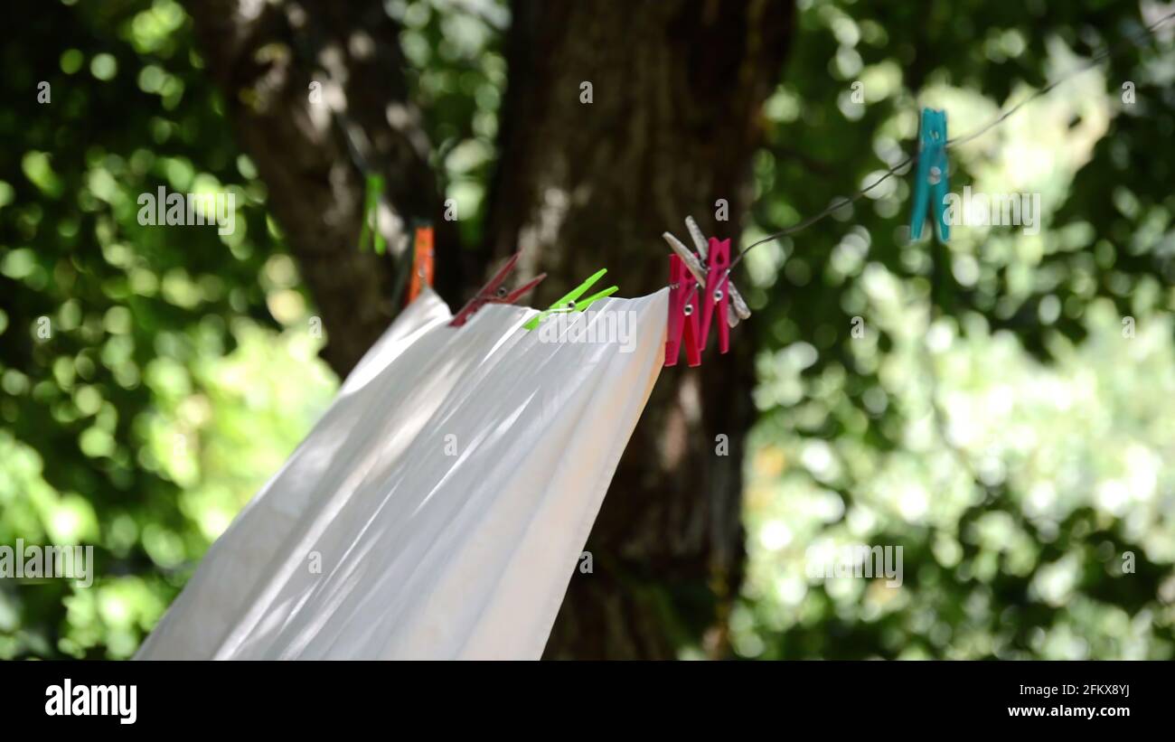 3D illustration - Fresh clean white sheets drying on washing line ...