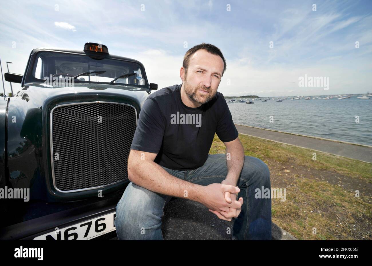EX FOOTBALLER JIMMY GLASS WITH ONE OF HIS CABS IN POOLE. 29/4/09 ...