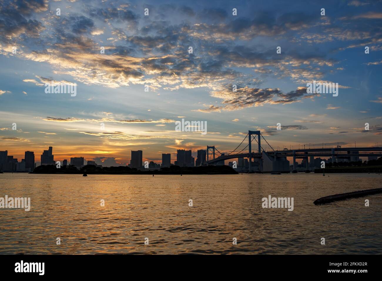 Tokyo skylines with Rainbow bridge at sunset. Japan Stock Photo - Alamy