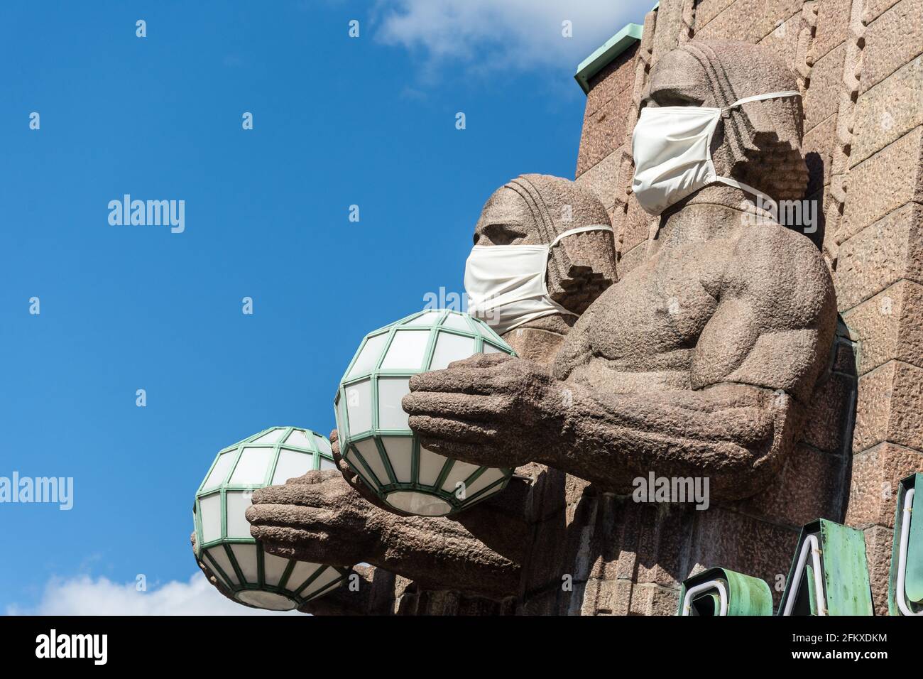 Lantern carrier statues by Emil Wikström with a mask on the Railway ...