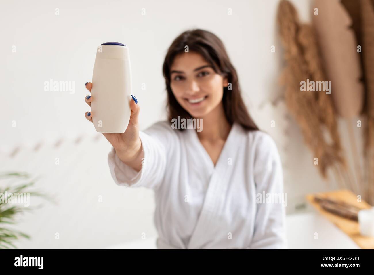 Lady Showing Shower Gel Bottle Advertising Cosmetics Product In ...