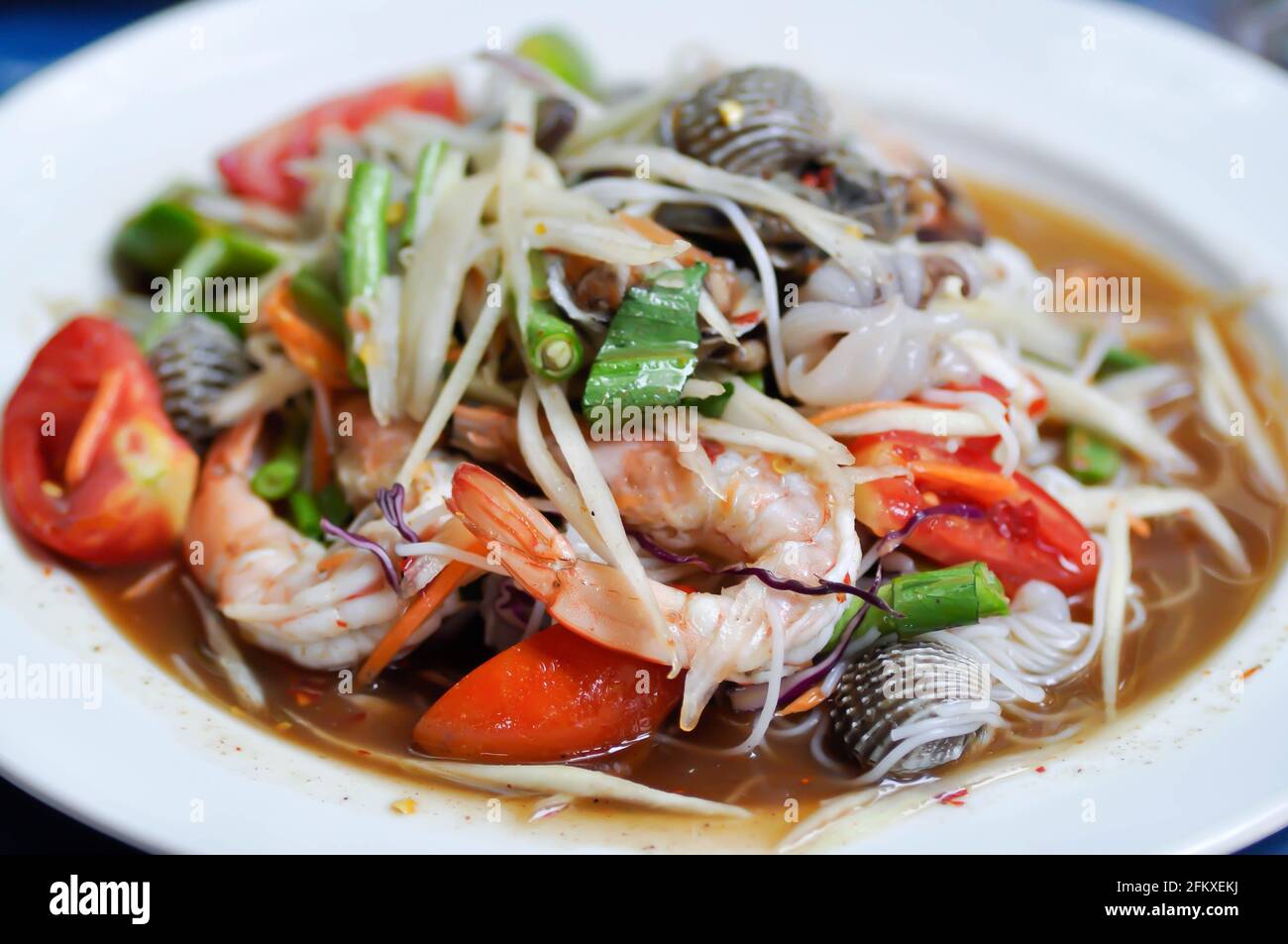 papaya salad, som tam or spicy shrimp and shell salad or Thai food ...
