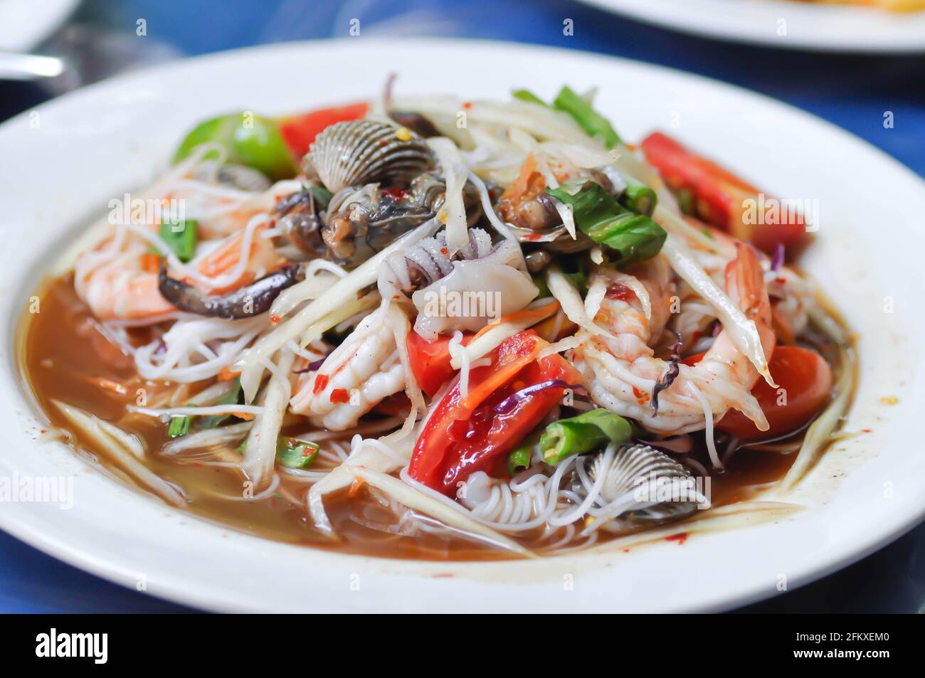 papaya salad, som tam or spicy shrimp and shell salad or Thai food ...