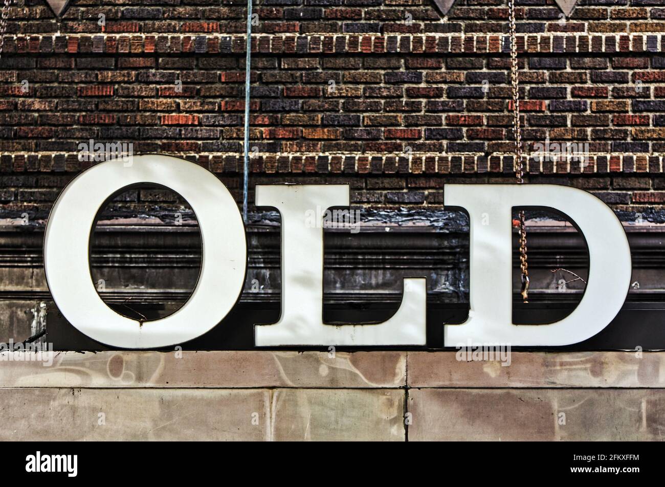 A sign that reads "Old" on the ledge of a building Stock Photo - Alamy