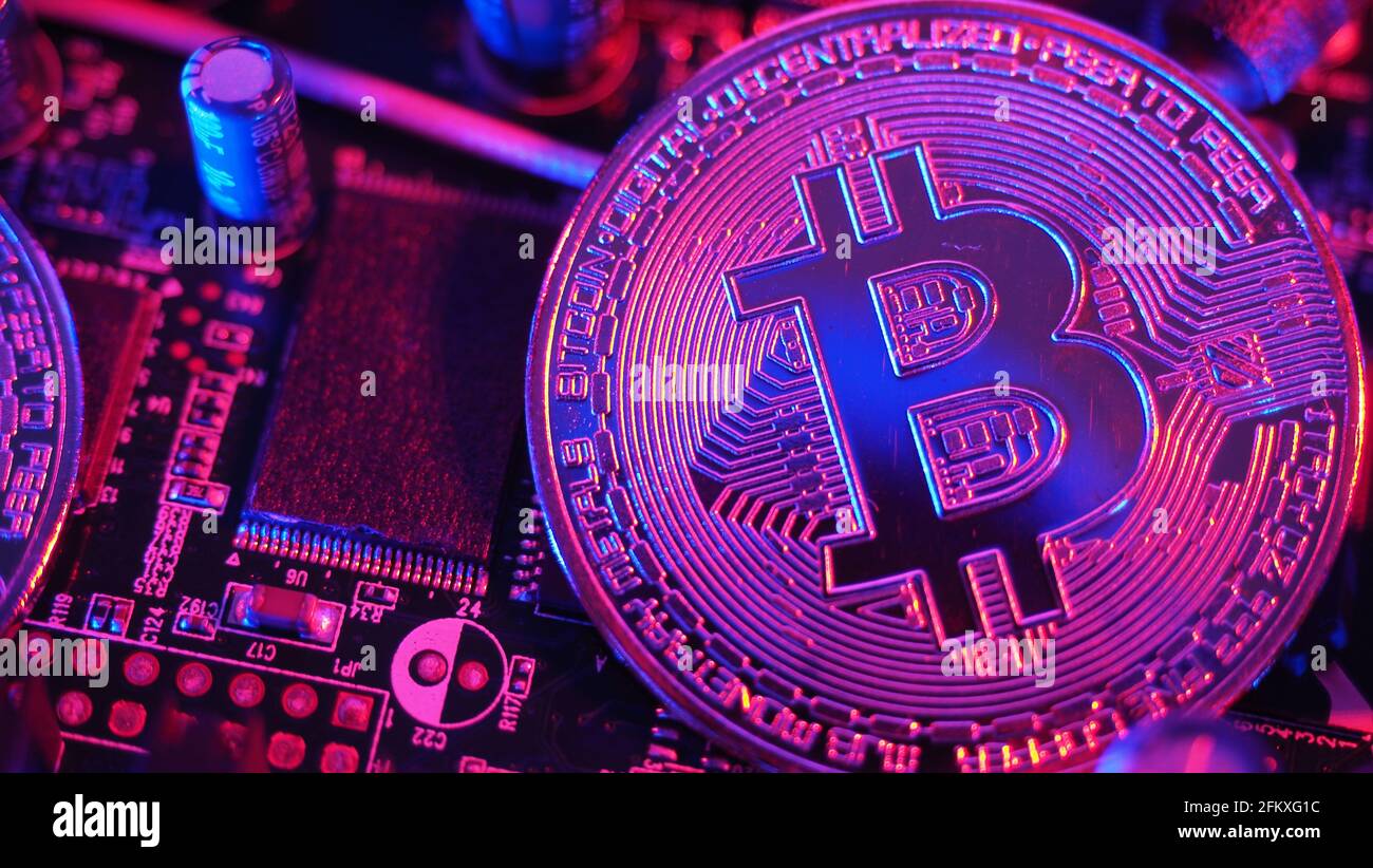 Bitcoin on circuit board. Cryptocurrency bit-coins and computer ...