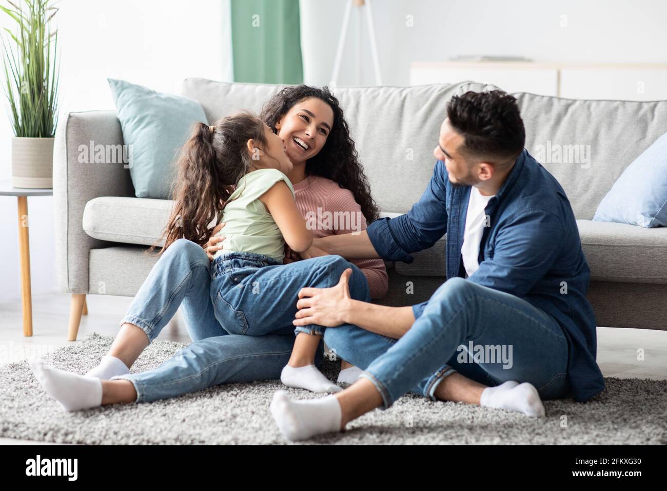 Family Insurance Concept. Portrait Of Cheerful Young Parents And Their ...