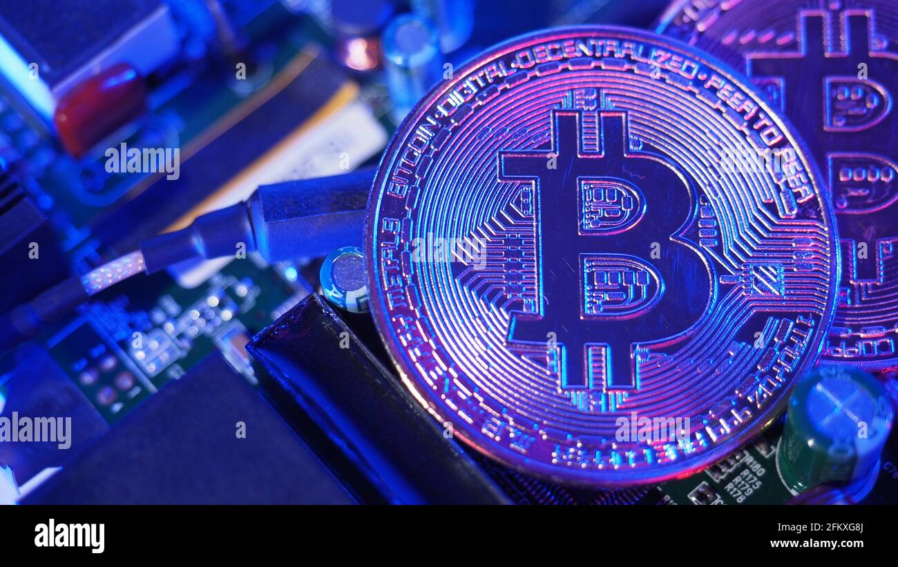 Bitcoin on circuit board. Cryptocurrency bit-coins and computer ...
