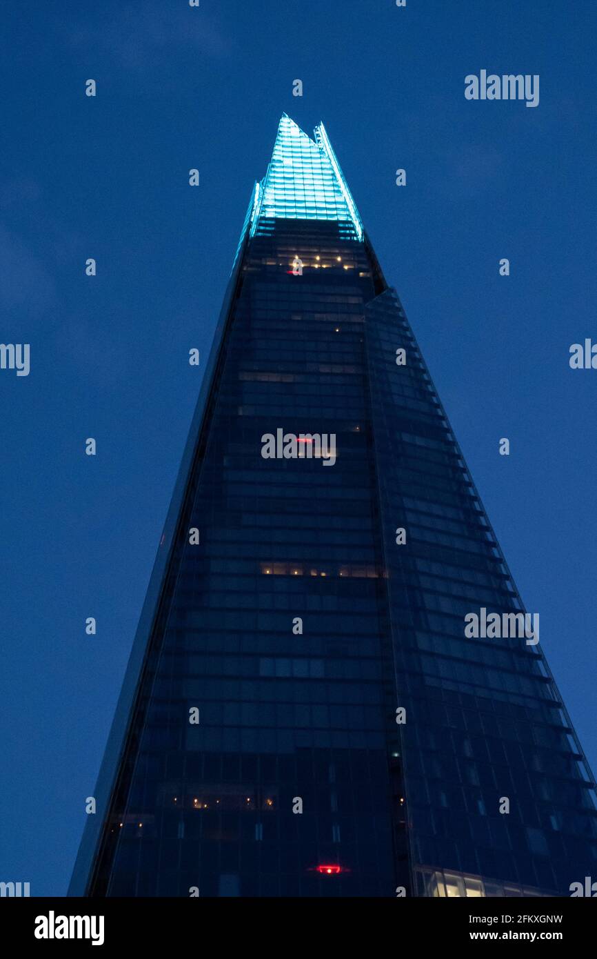 London - Britain - 20200430 - The Shard light up in blue to show ...