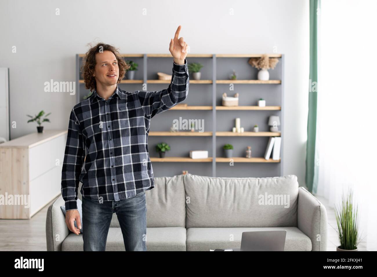 Man Pointing Finger Up Pushing Button On Invisible Screen Indoors Stock ...