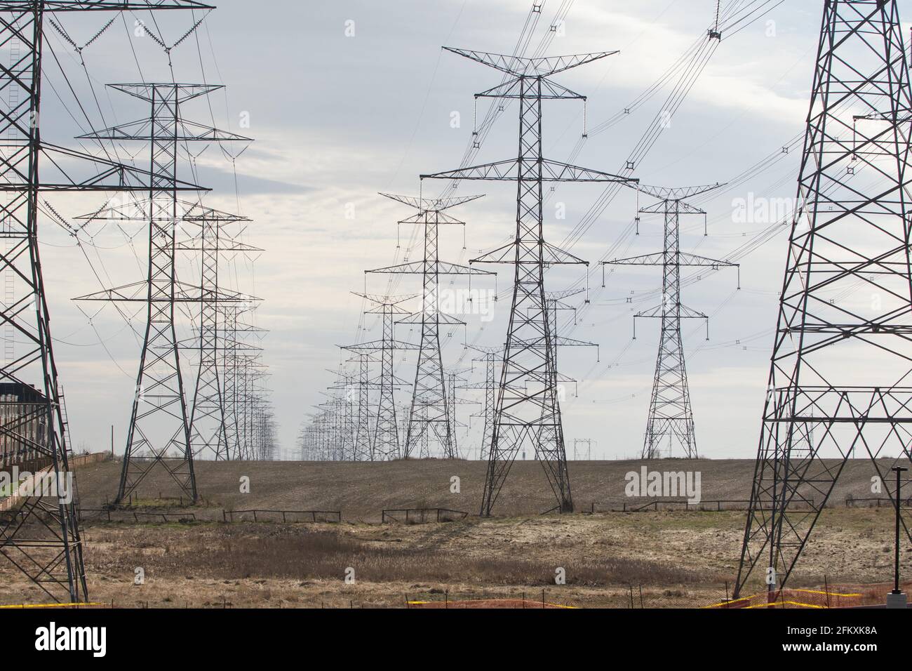 These electrical power lines strung on towers form the backbone of ...