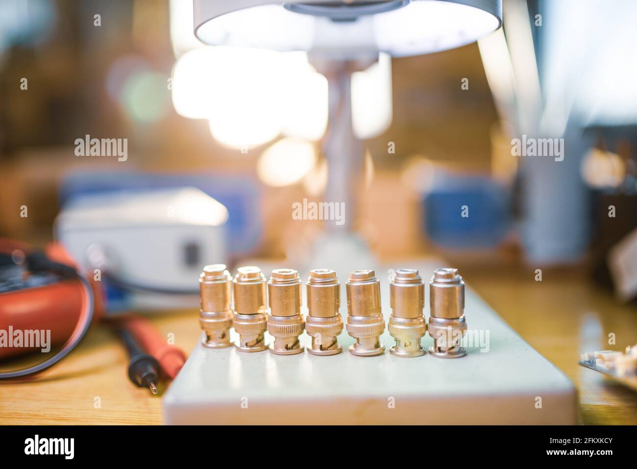 Modern microscope, connectors component and large green microcircuit in ...