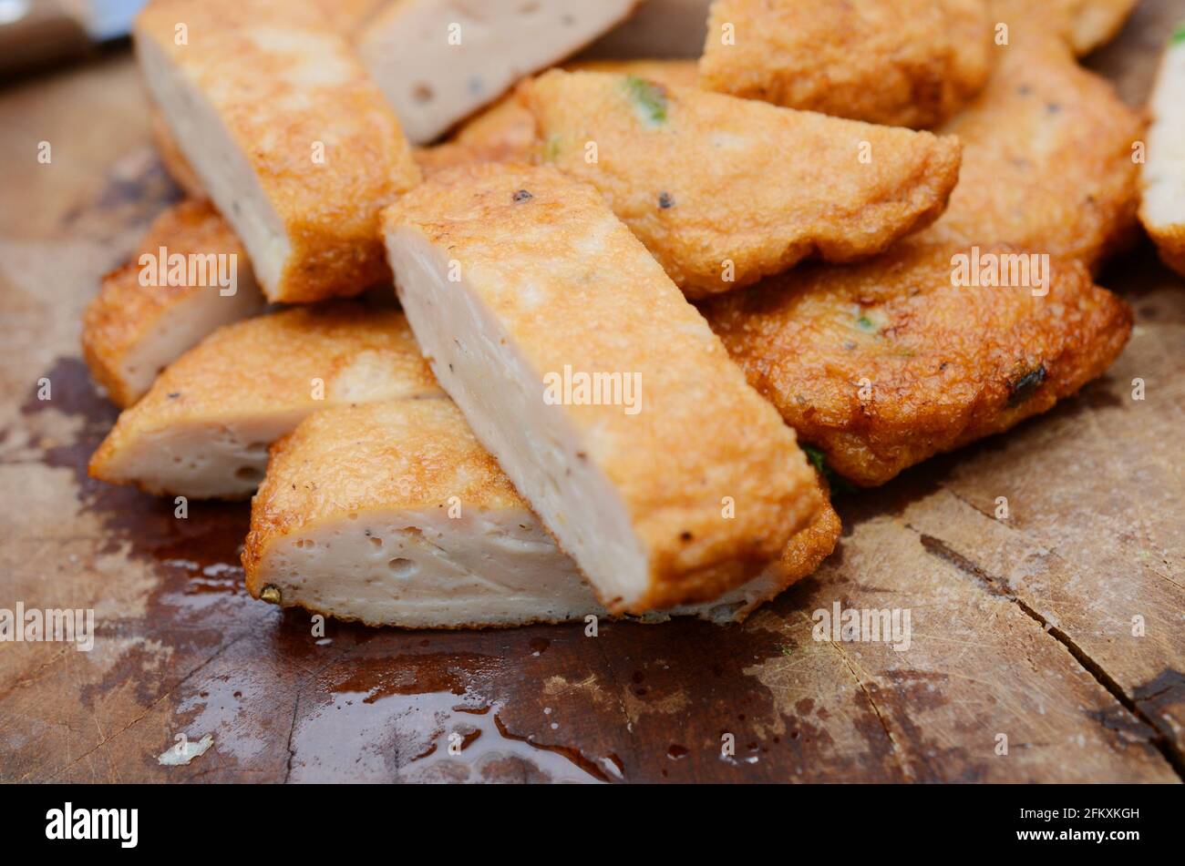 Fried fishcake slices Stock Photo - Alamy