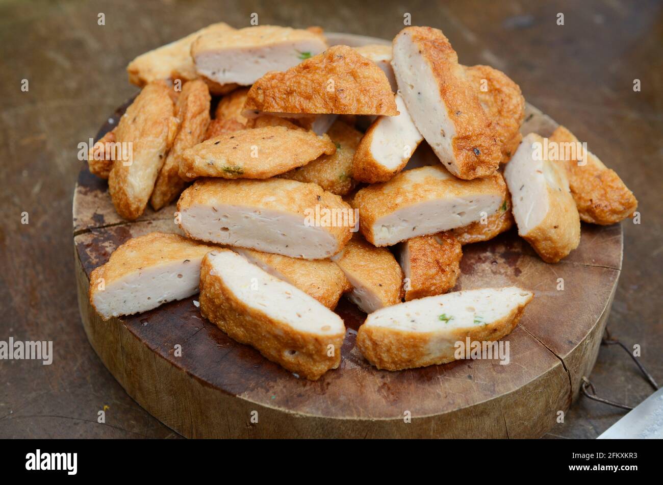Delicious fried fishcake sliced Stock Photo - Alamy