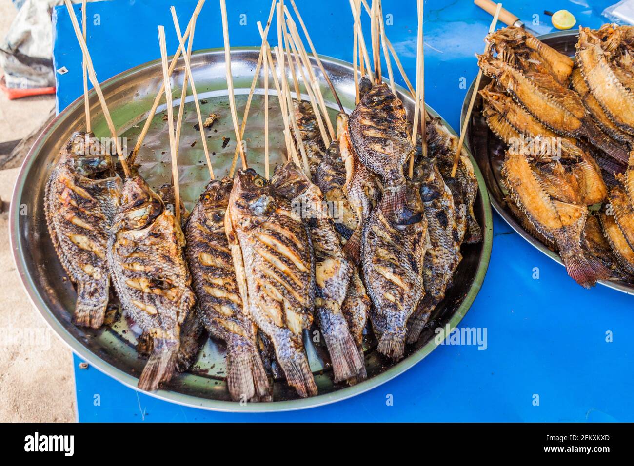Grilled fish on sticks at Inle lake, Myanmar Stock Photo - Alamy