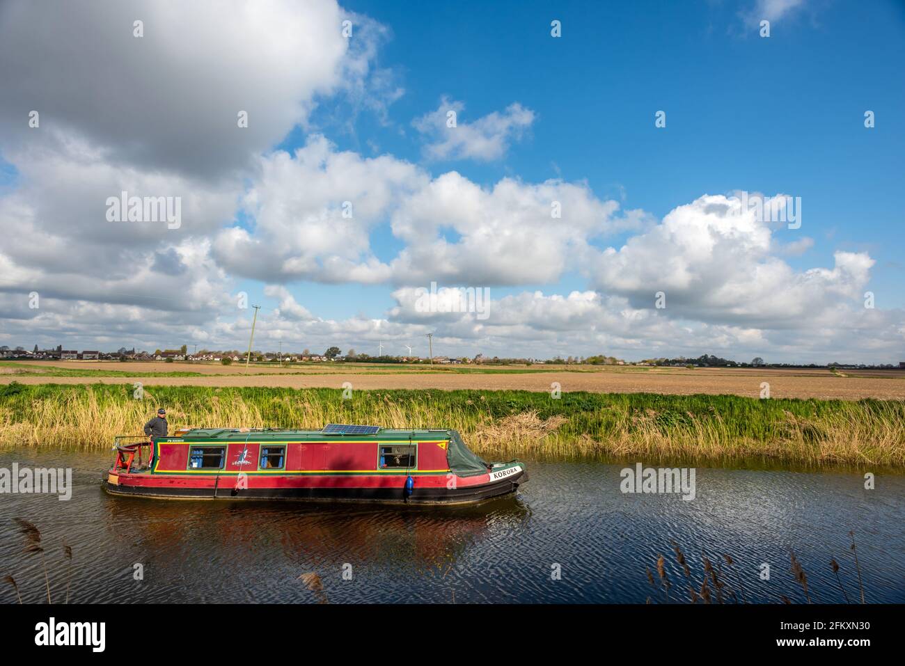 March, May 1st 2021: A longboat travelling the fens and canals of ...