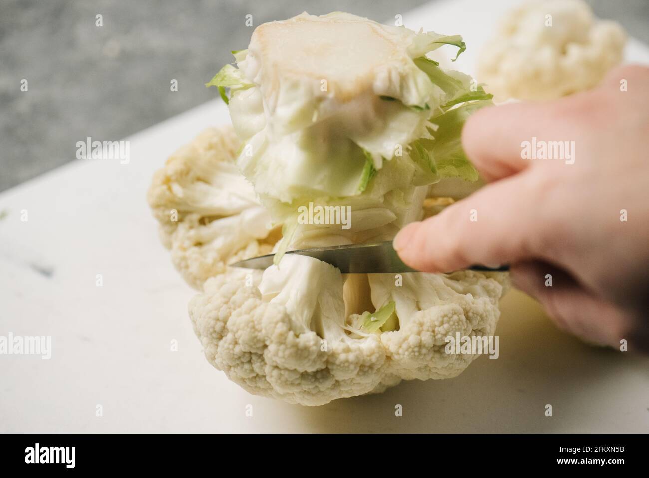Closeup photo showing how to properly cut Cauliflower Stock Photo - Alamy