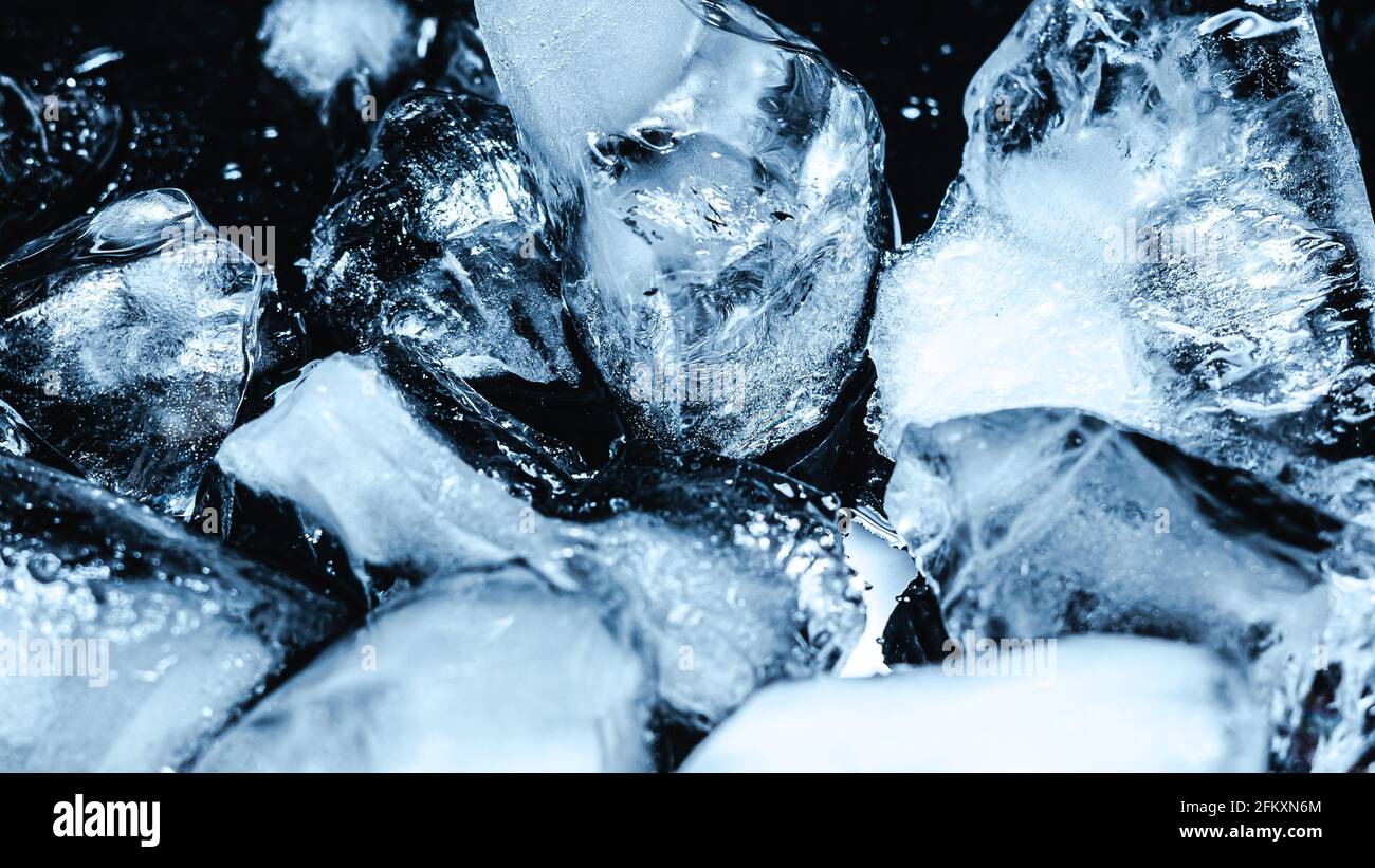 Ice cubes on a black surface. Beautiful texture background fresh cool ...