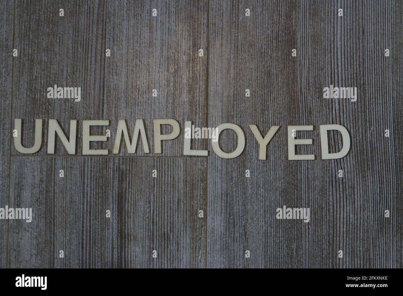 the word unemployed in a flat lay concept Stock Photo - Alamy